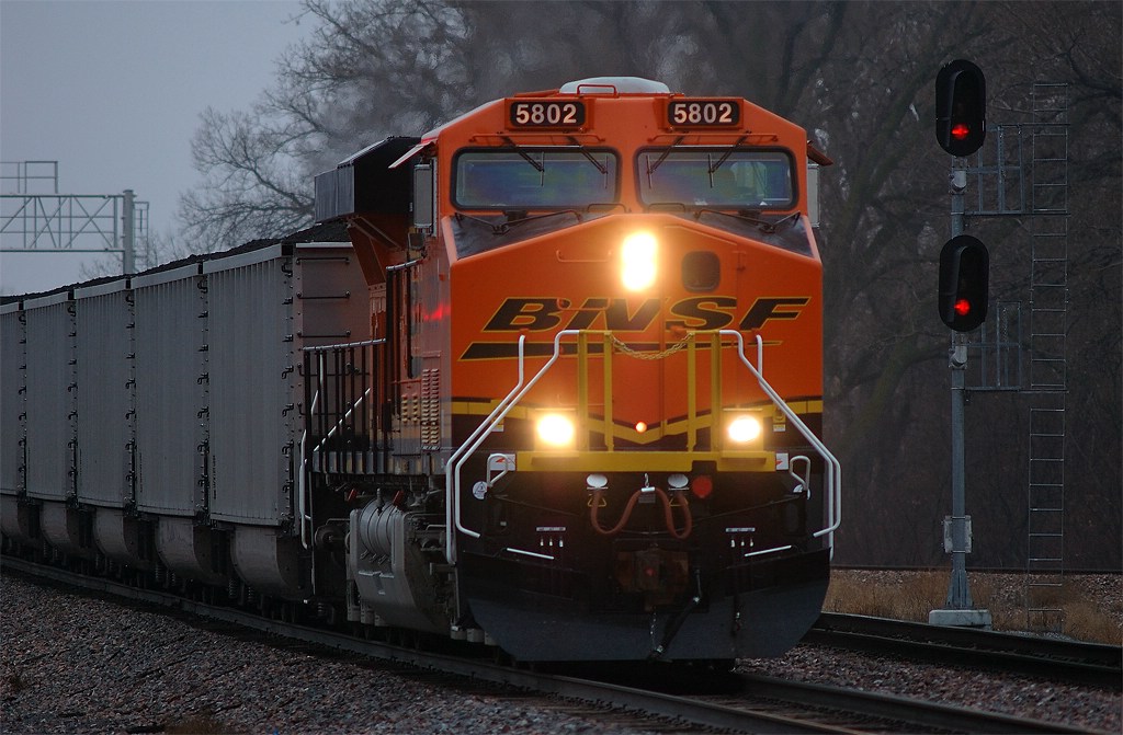 BNSF 5802, GEVO ES44AC, leads coal loads eastbound onto the Creston Sub